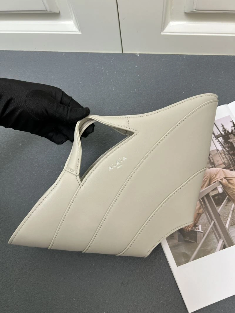 Brand-authenticated Alaia Top Handle Bags