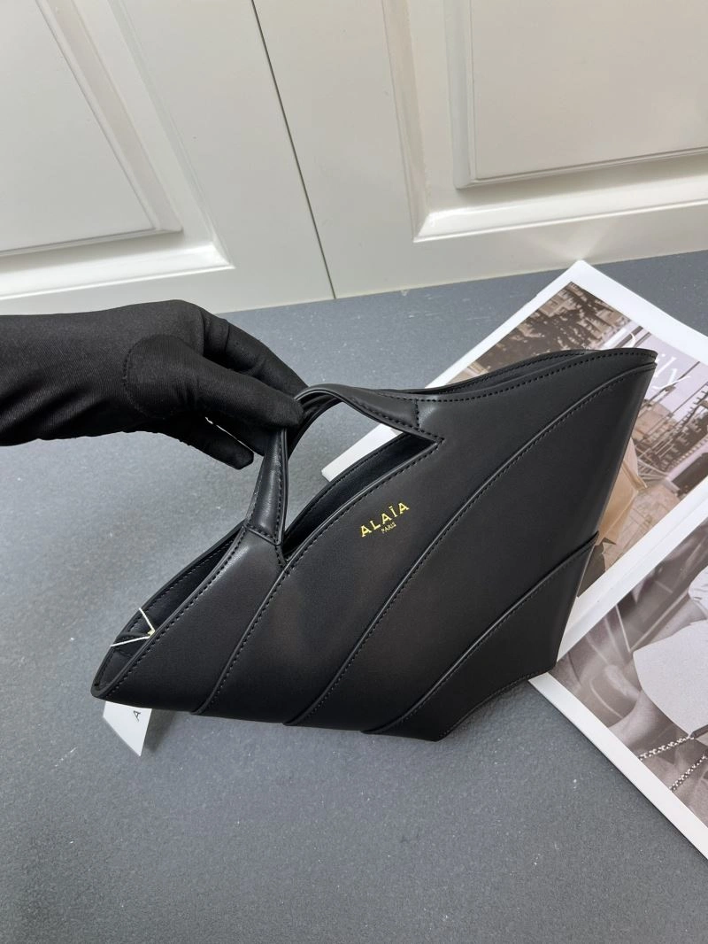Value-priced Alaia Top Handle Bags