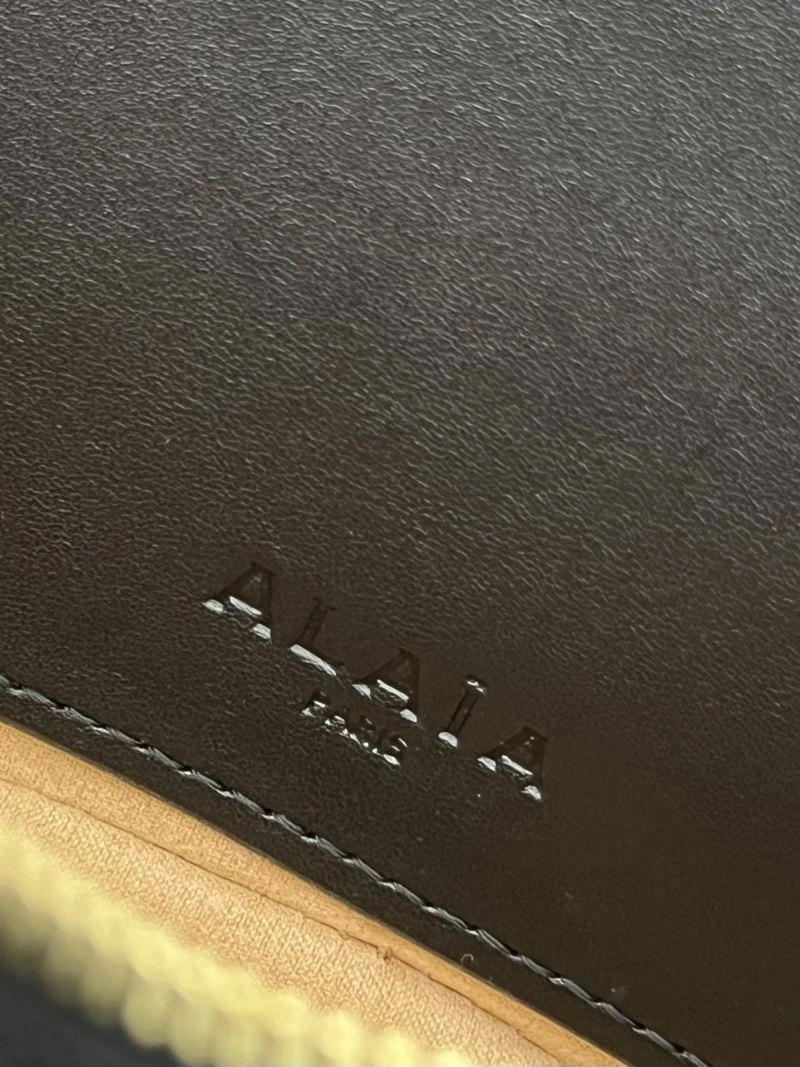 Value-priced Alaia Top Handle Bags