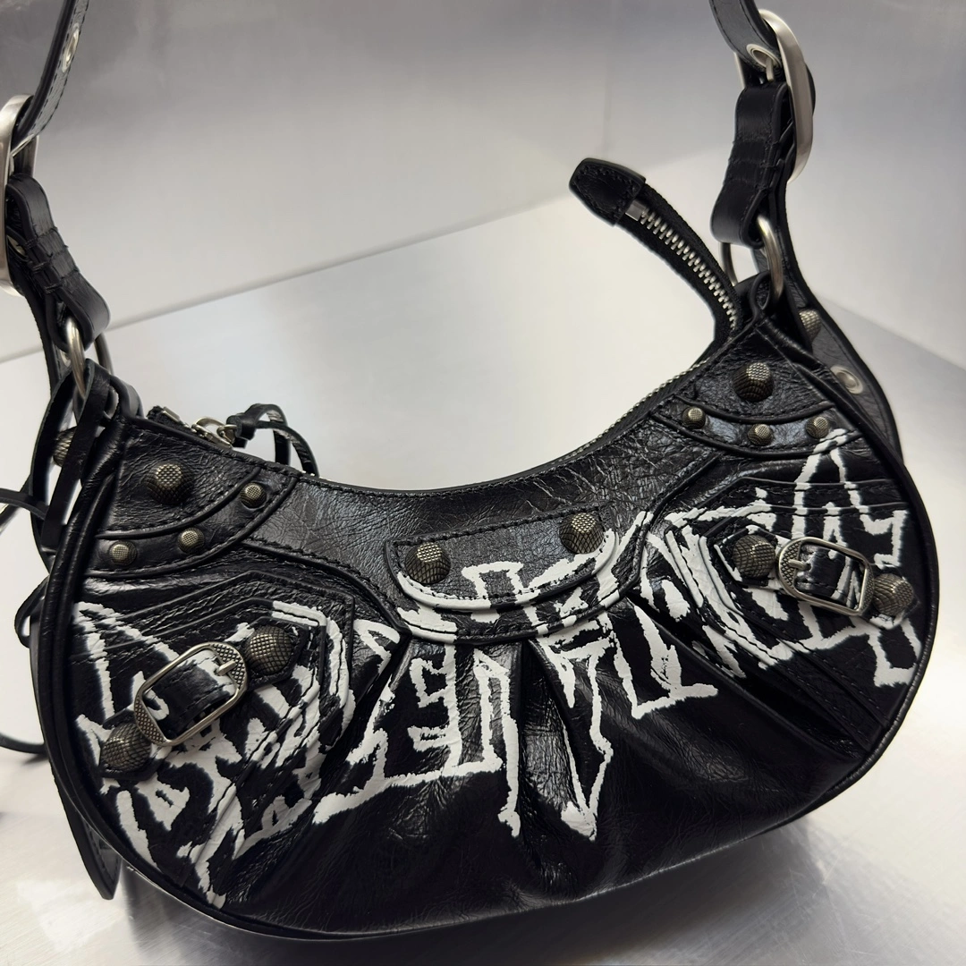 Reasonably priced Balenciaga Le Cagole Graffiti Half-Moon Shoulder Bag - Retro Rock Chic