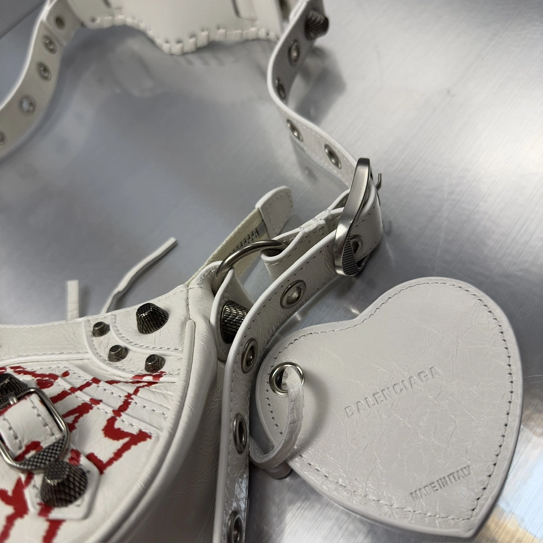 Budget-friendly Balenciaga Le Cagole Graffiti Half-Moon Underarm Bag - Retro Rock Chic
