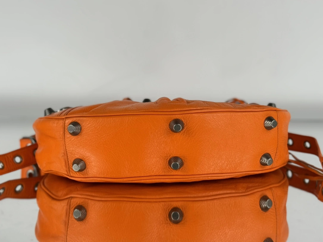 Value-priced Balenciaga Le Cagole Half-Moon Dumpling Bag in Oil Wax Orange