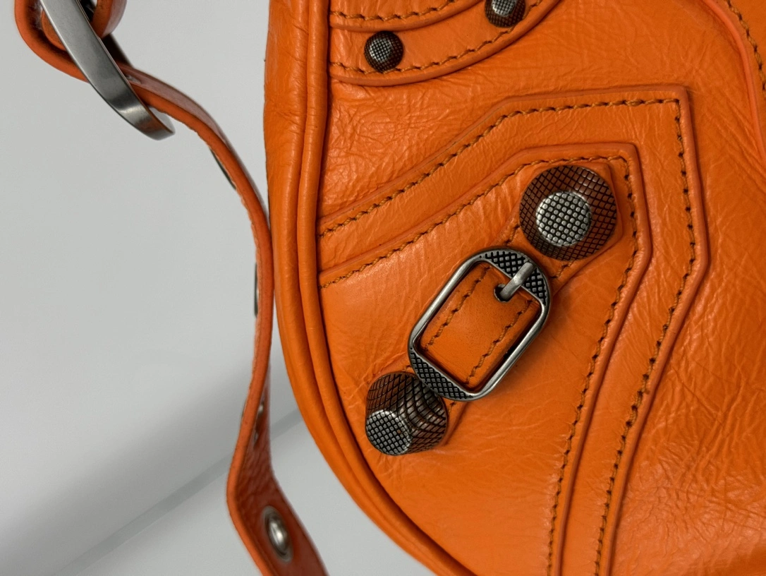 Value-priced Balenciaga Le Cagole Half-Moon Dumpling Bag in Oil Wax Orange