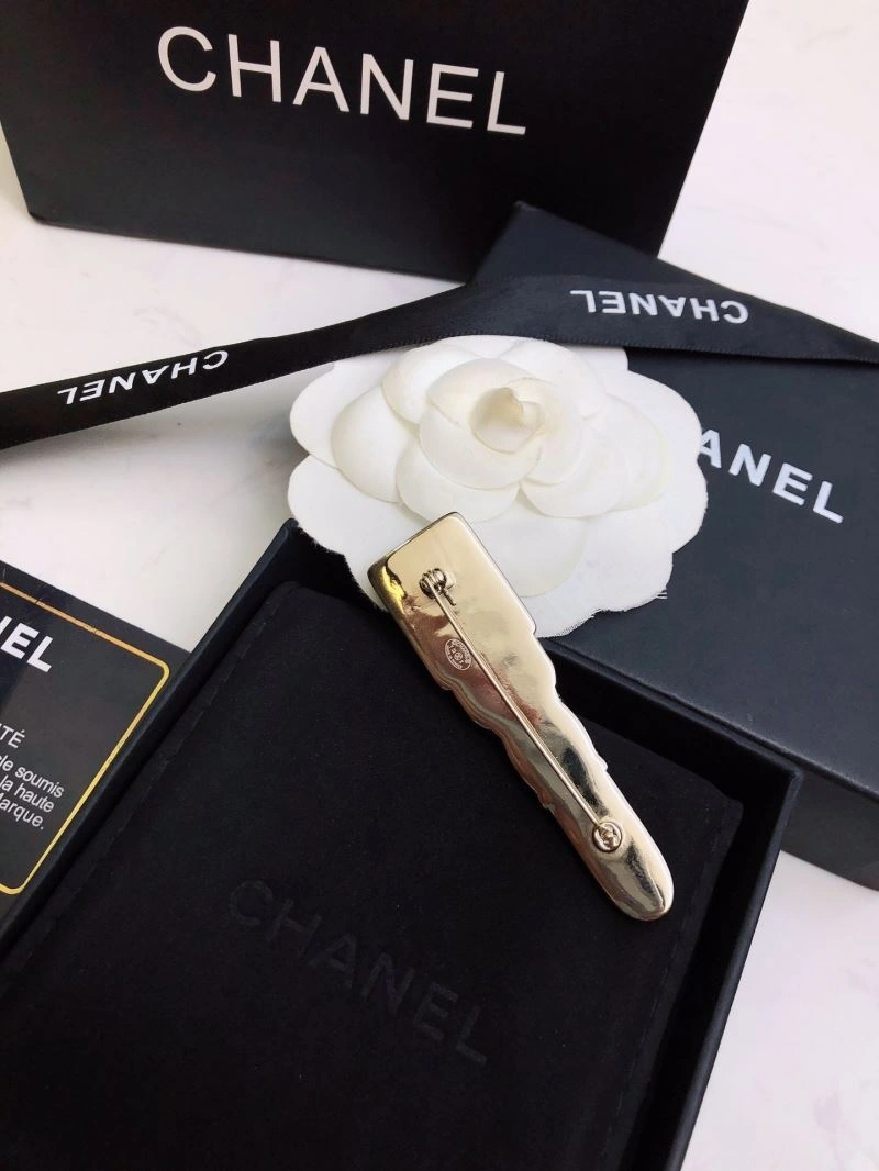 Indistinguishable Chanel Brooches