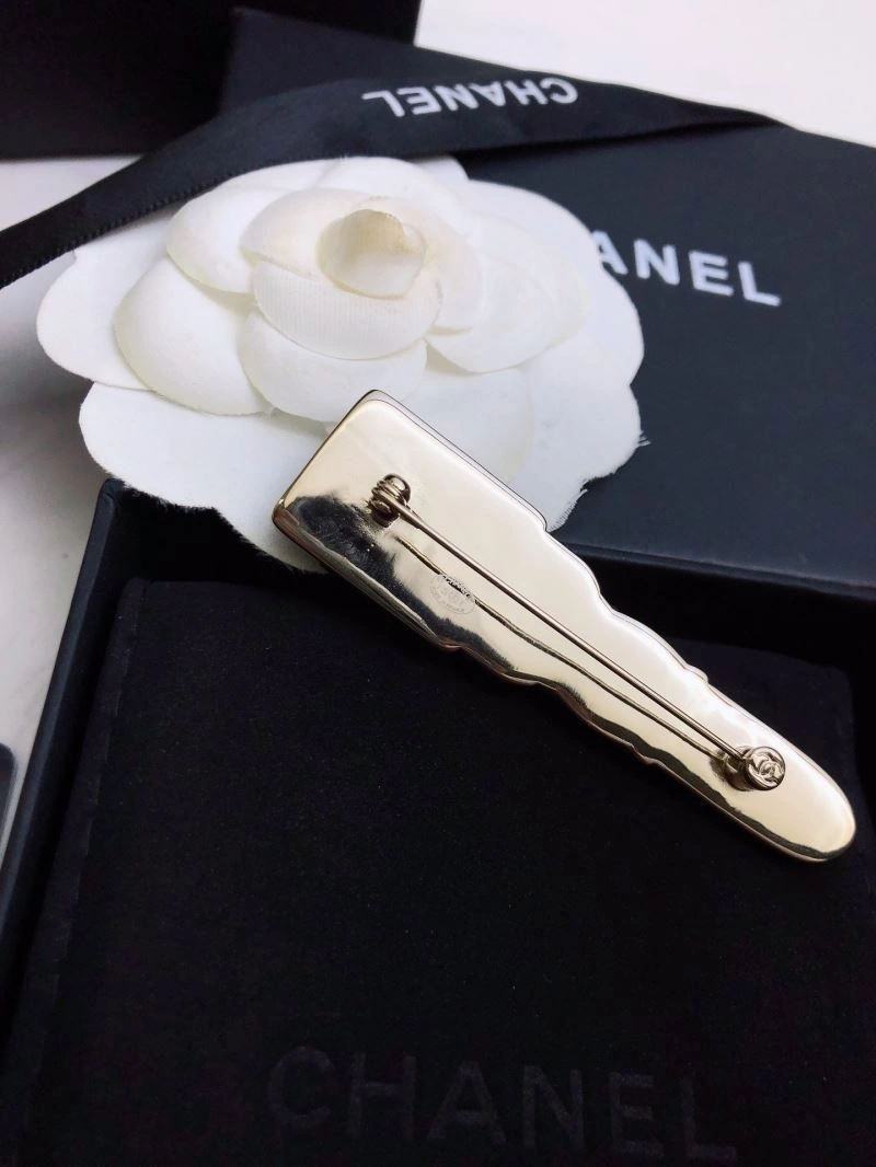 Indistinguishable Chanel Brooches