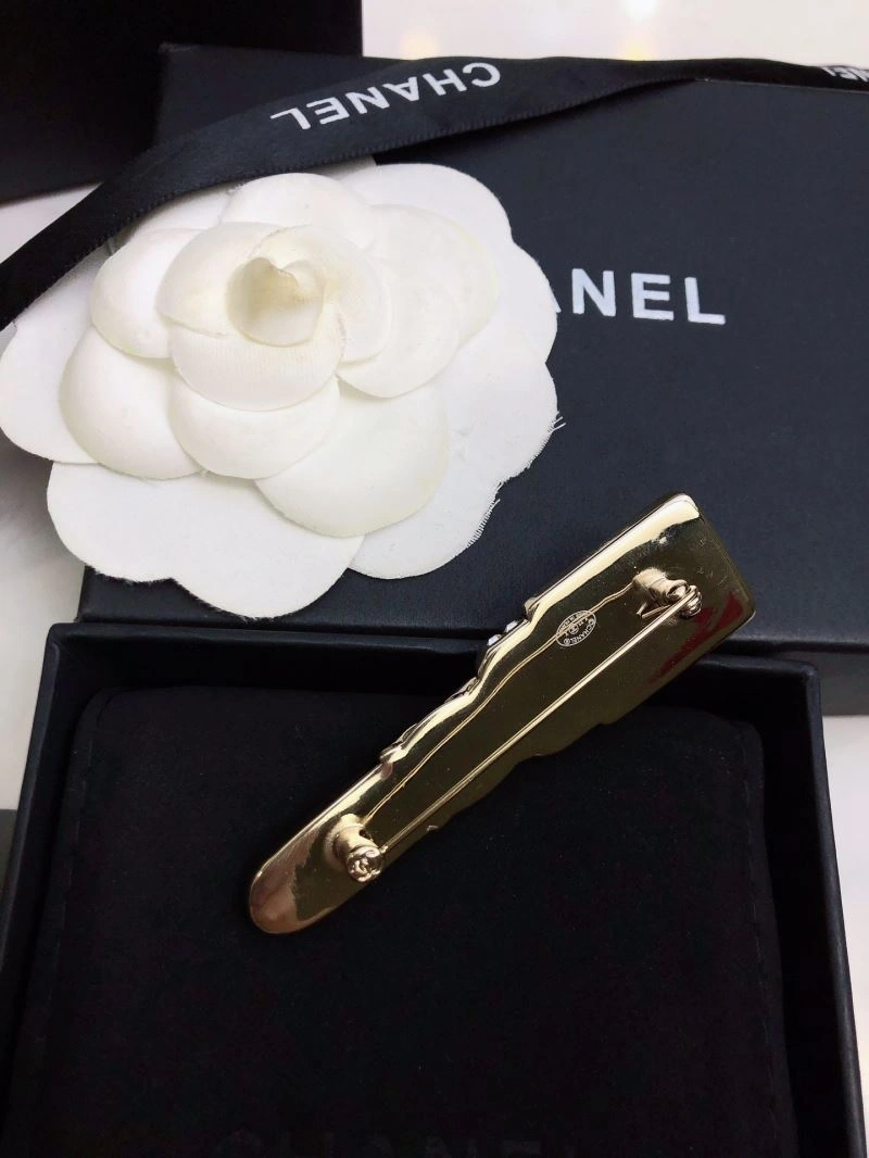 Indistinguishable Chanel Brooches