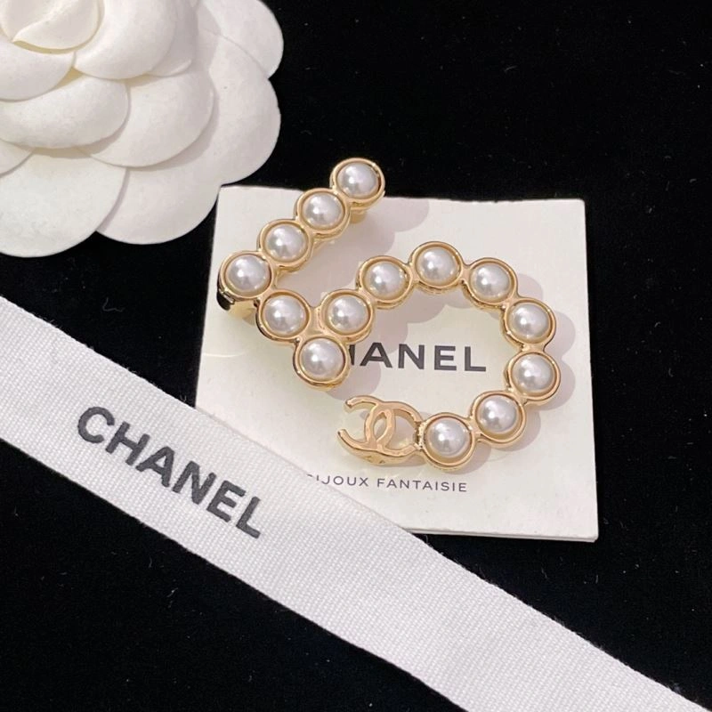 Indistinguishable Chanel Brooches