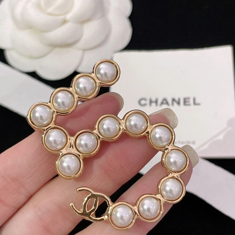 Indistinguishable Chanel Brooches