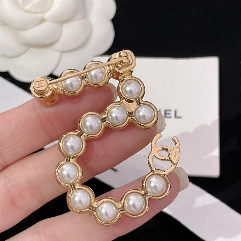 Indistinguishable Chanel Brooches