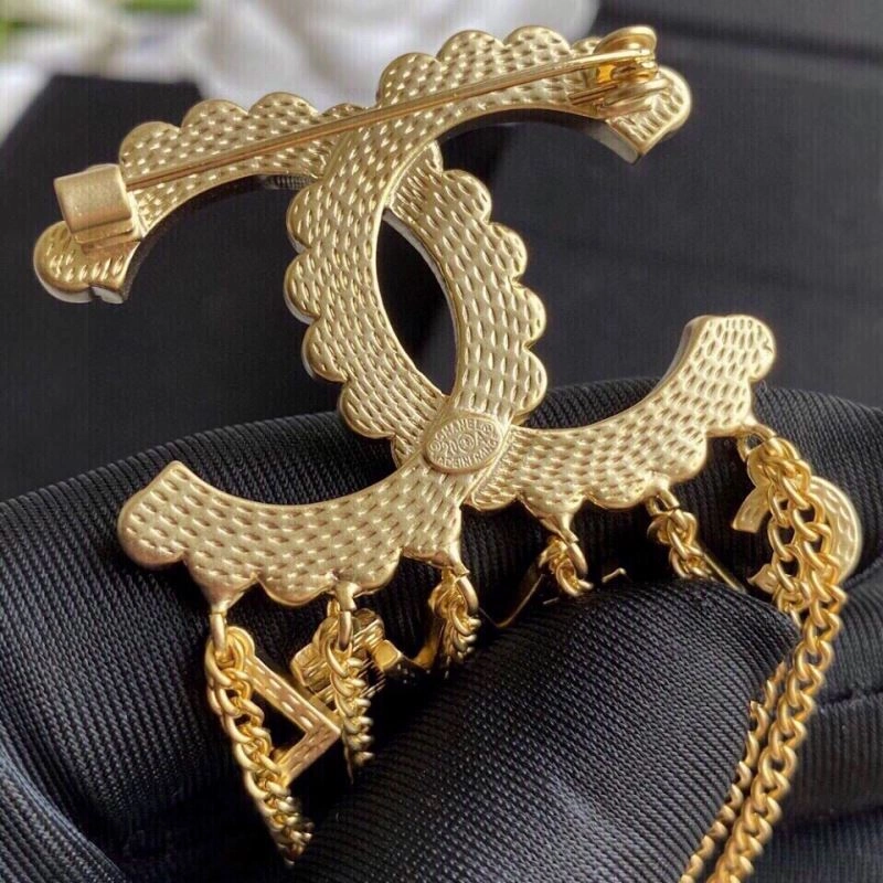 Indistinguishable Chanel Brooches