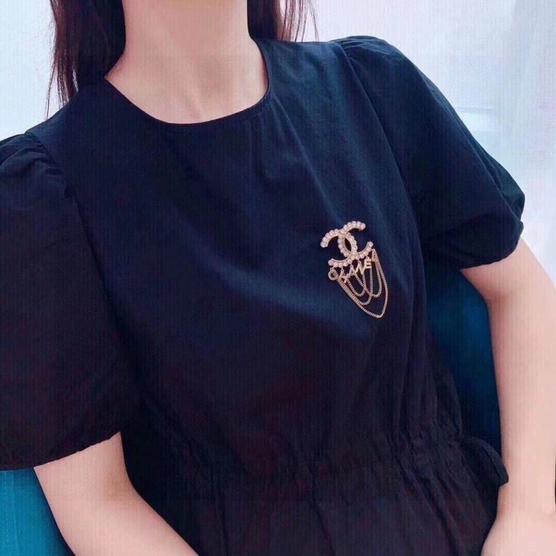 Indistinguishable Chanel Brooches