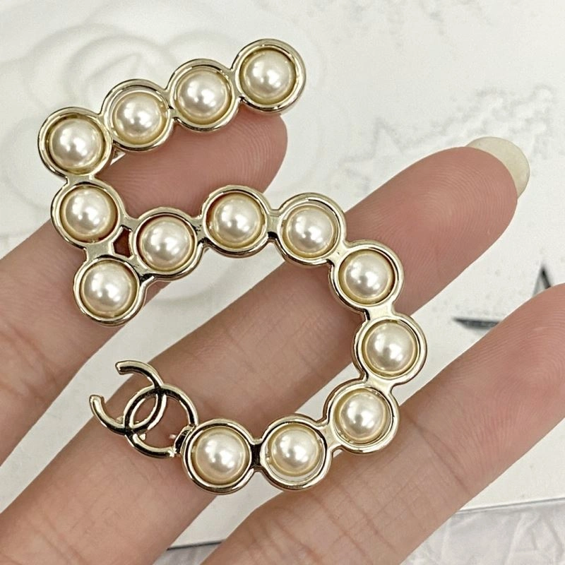 Indistinguishable Chanel Brooches