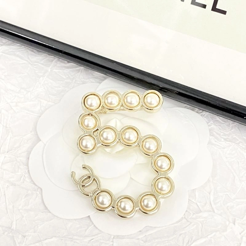 Indistinguishable Chanel Brooches