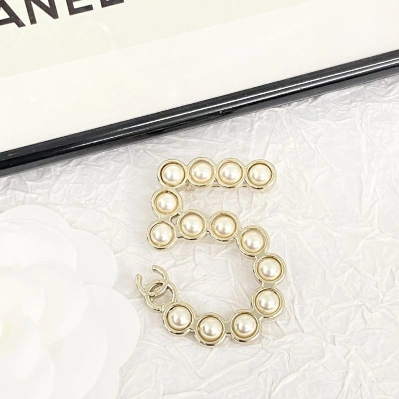 Indistinguishable Chanel Brooches