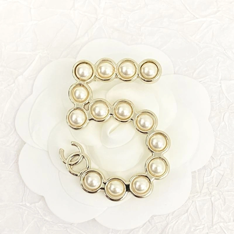 Indistinguishable Chanel Brooches