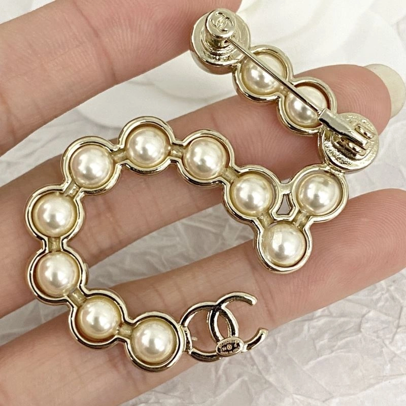 Indistinguishable Chanel Brooches