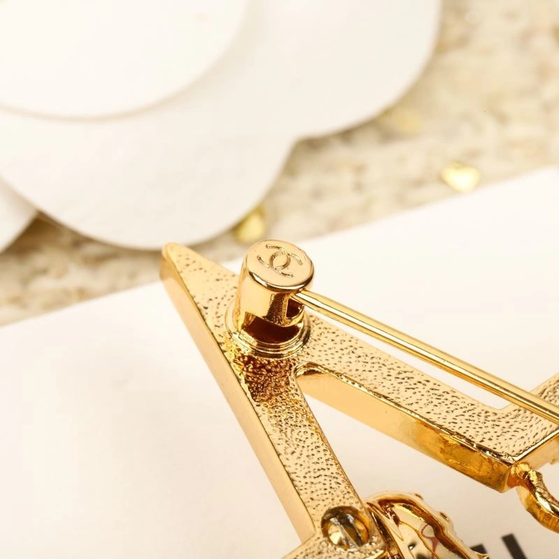 Cut-rate Chanel Brooches