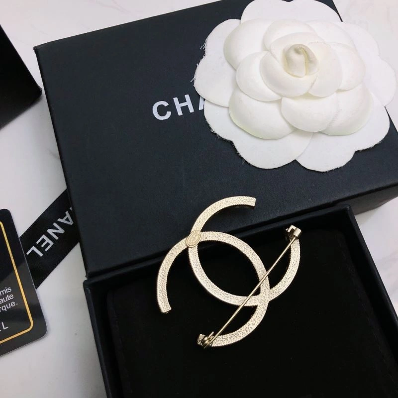 Indistinguishable Chanel Brooches