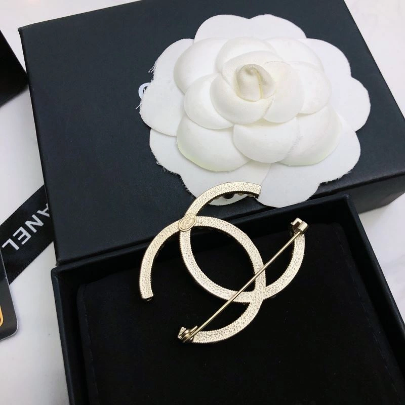 Indistinguishable Chanel Brooches