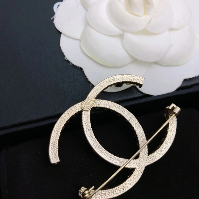 Indistinguishable Chanel Brooches