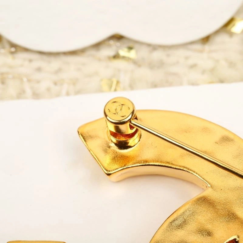 Cut-rate Chanel Brooches