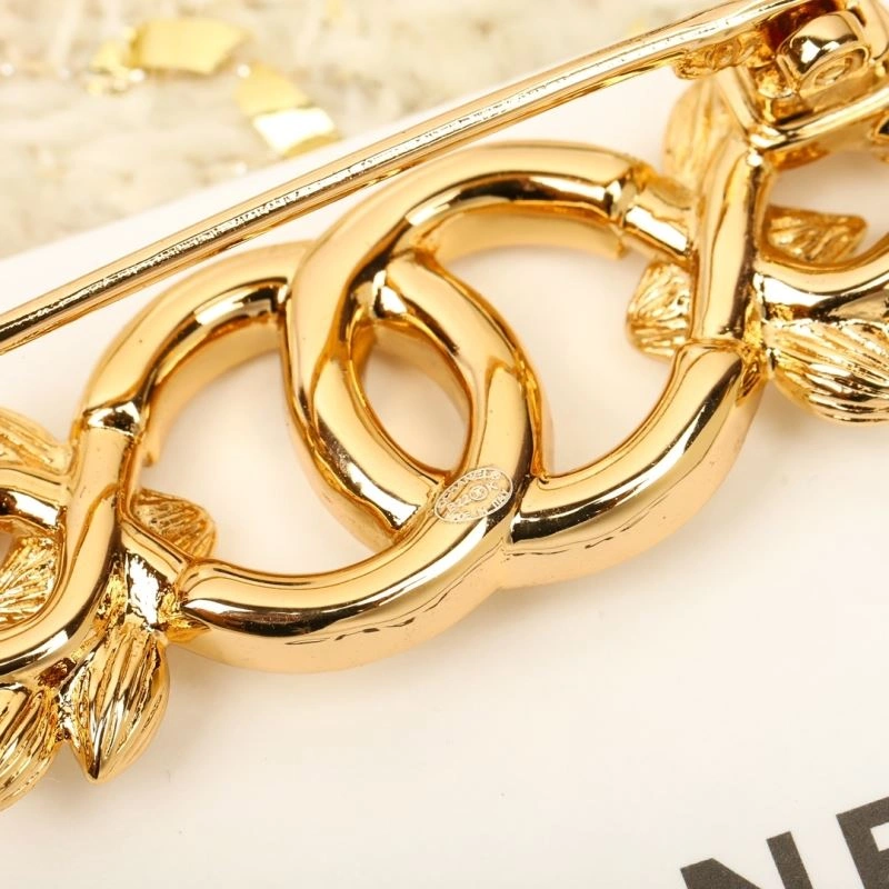 Indistinguishable Chanel Brooches