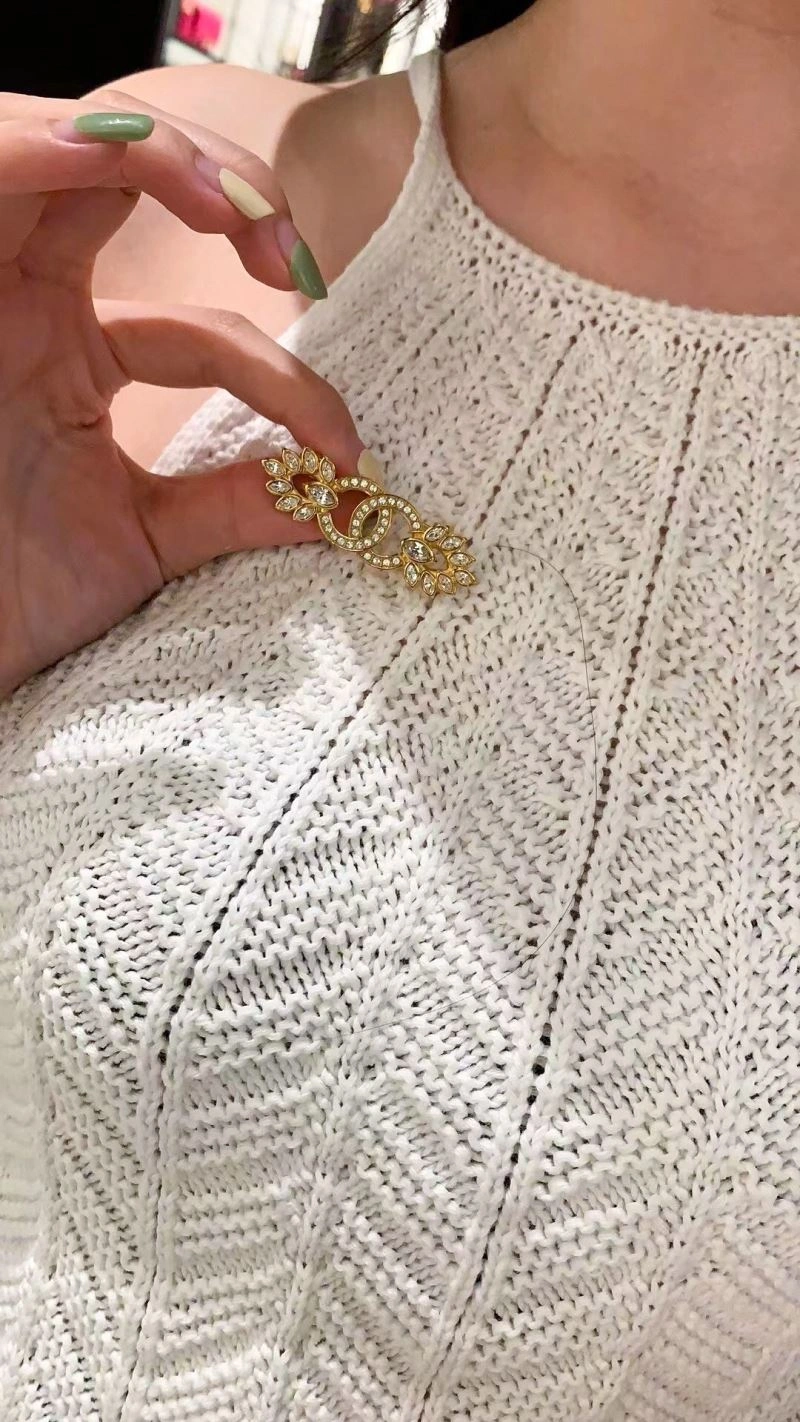Indistinguishable Chanel Brooches