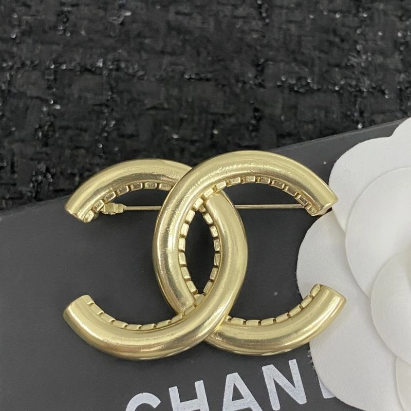 Indistinguishable Chanel Brooches