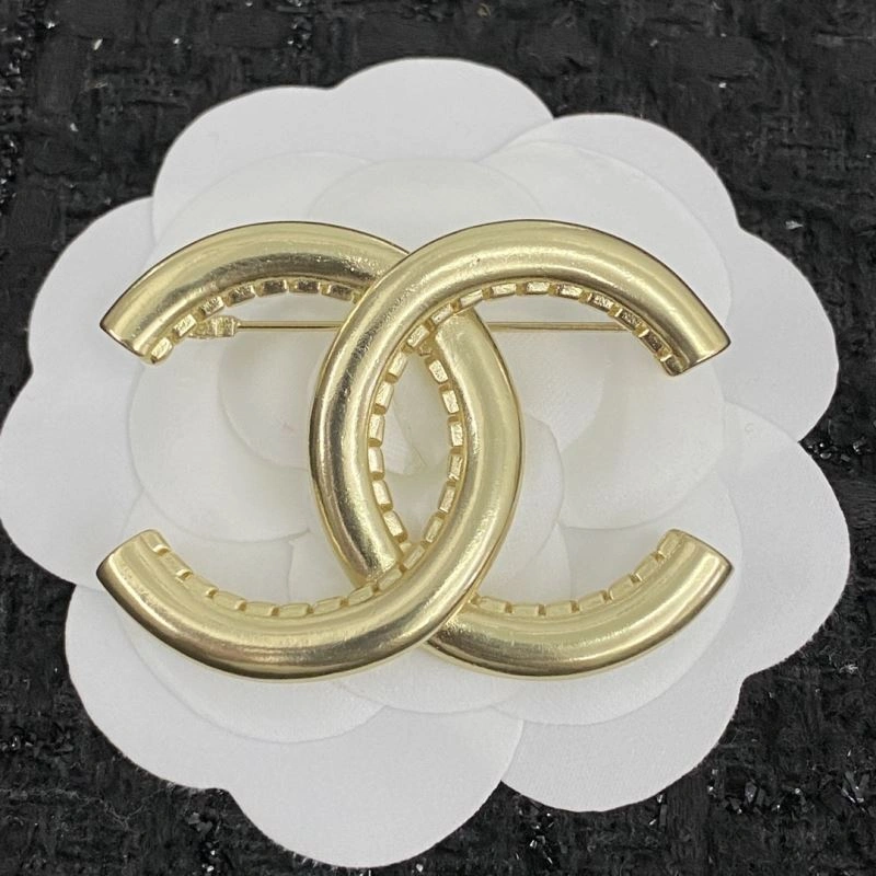 Indistinguishable Chanel Brooches