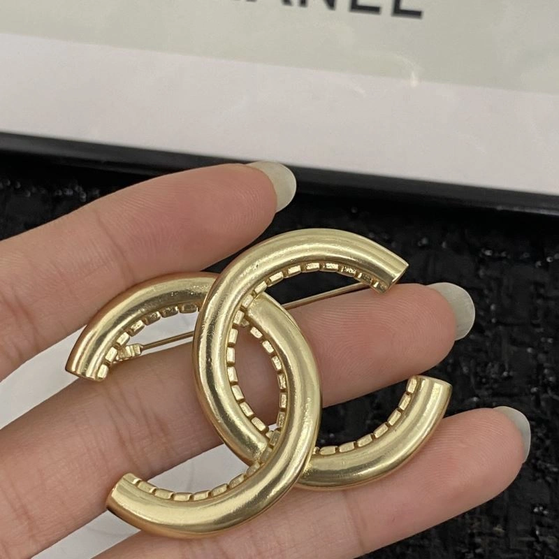 Indistinguishable Chanel Brooches