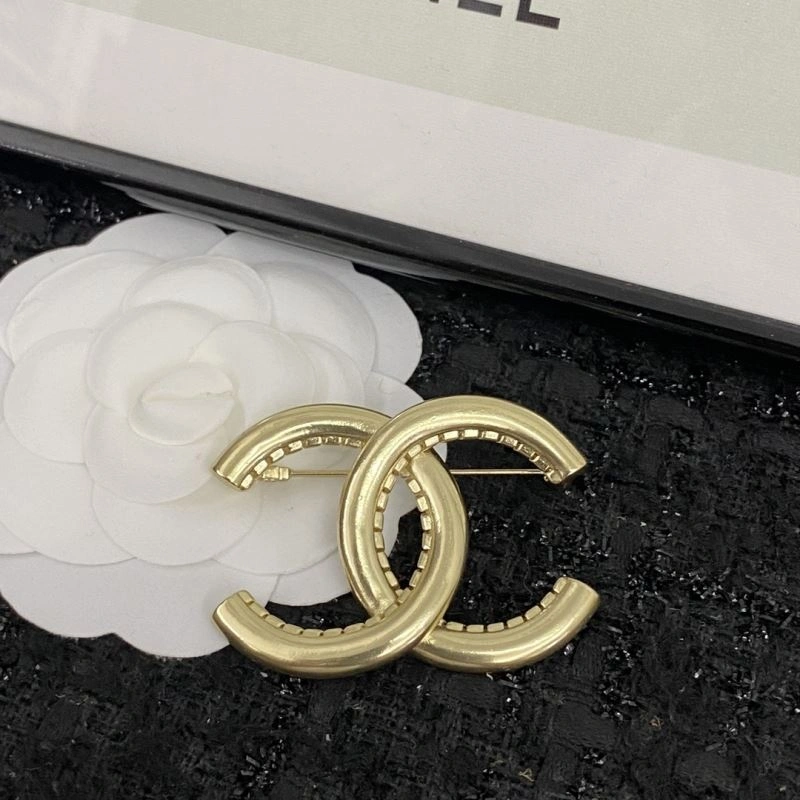 Indistinguishable Chanel Brooches