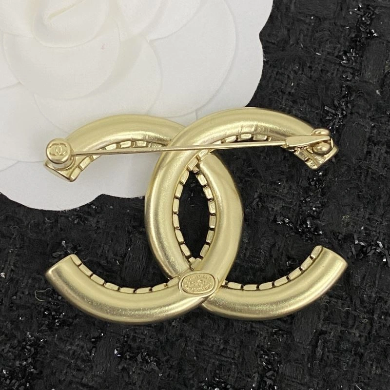 Indistinguishable Chanel Brooches