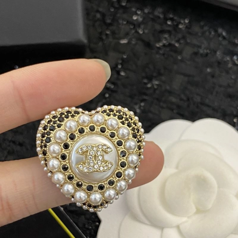 Indistinguishable Chanel Brooches