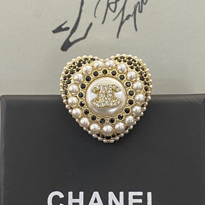 Indistinguishable Chanel Brooches