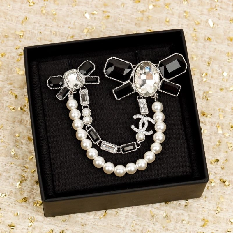 Indistinguishable Chanel Brooches