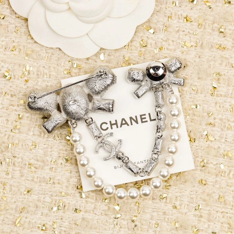 Indistinguishable Chanel Brooches