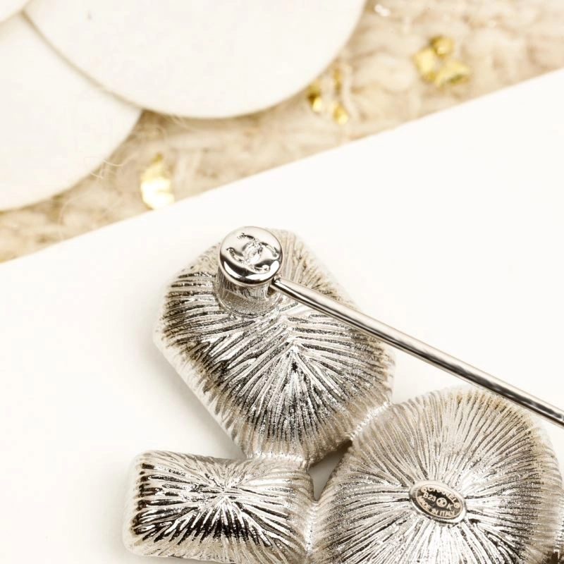 Indistinguishable Chanel Brooches