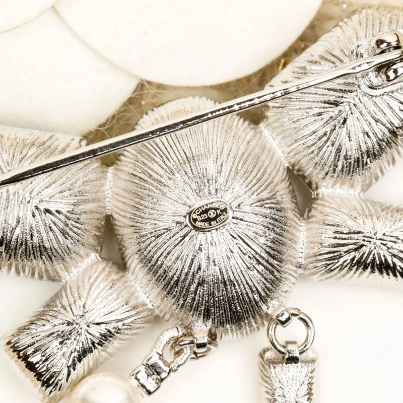 Indistinguishable Chanel Brooches