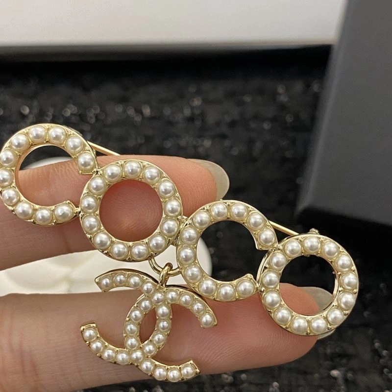Indistinguishable Chanel Brooches
