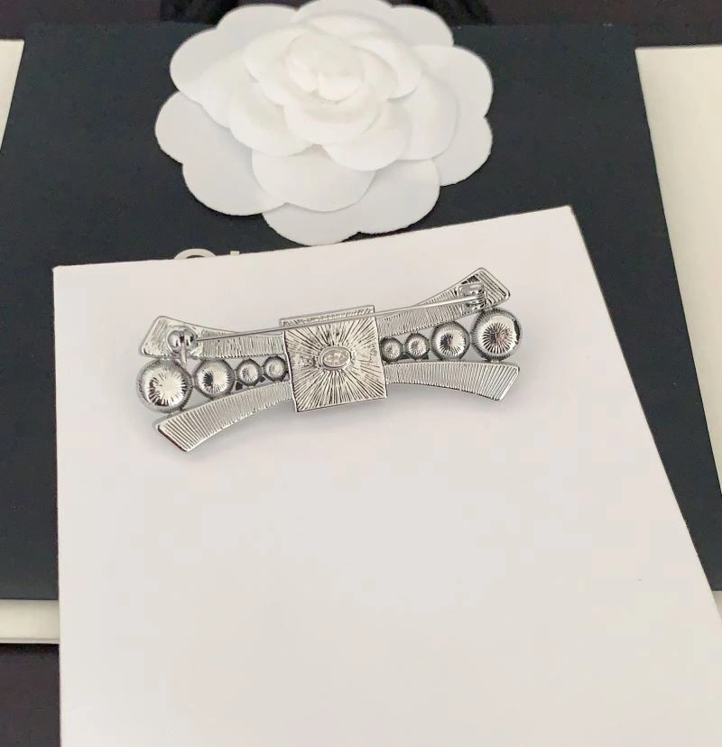 Cut-rate Chanel Brooches