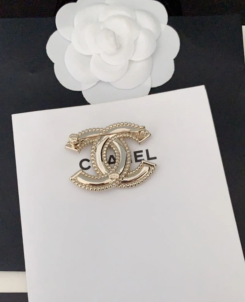 Indistinguishable Chanel Brooches