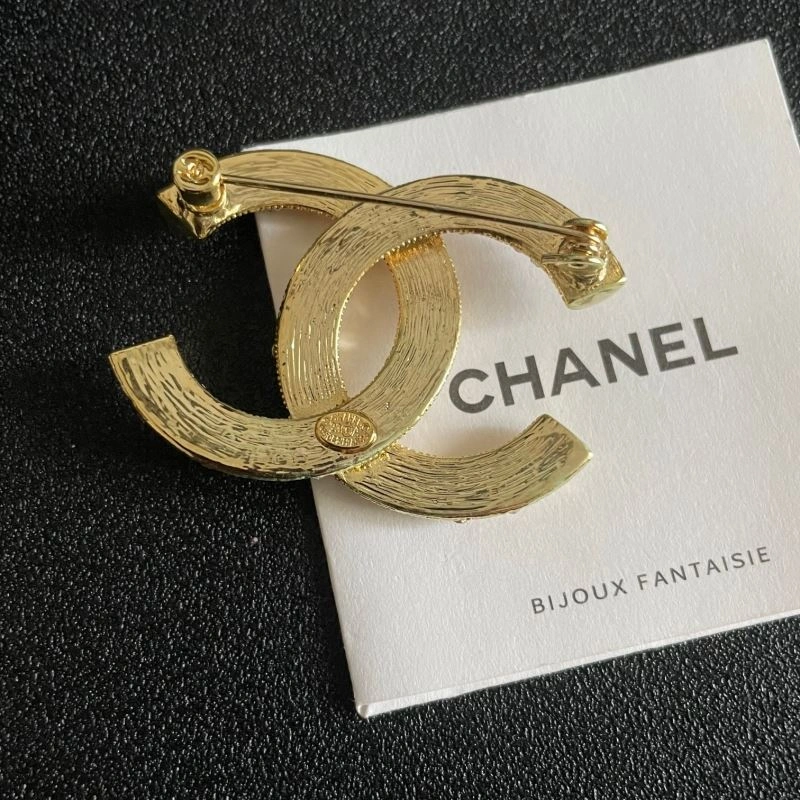 Indistinguishable Chanel Brooches
