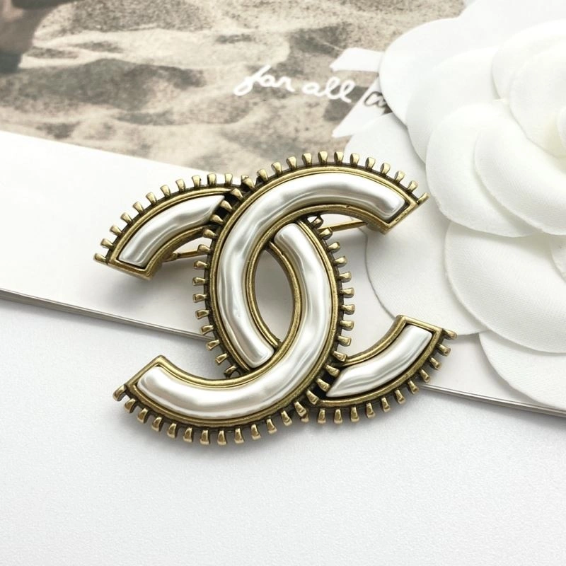 Indistinguishable Chanel Brooches