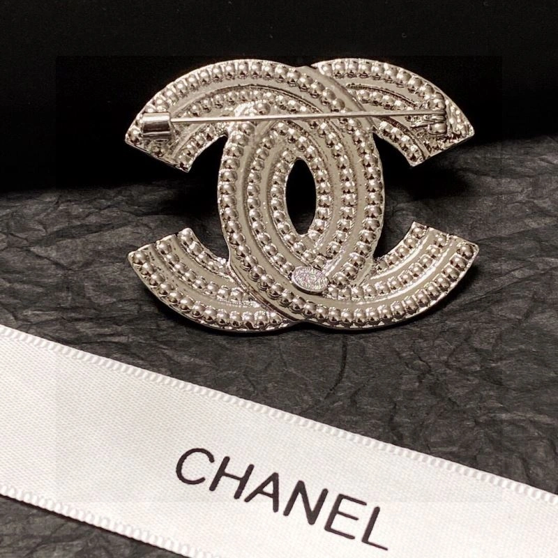 Indistinguishable Chanel Brooches