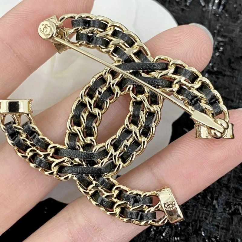 Indistinguishable Chanel Brooches