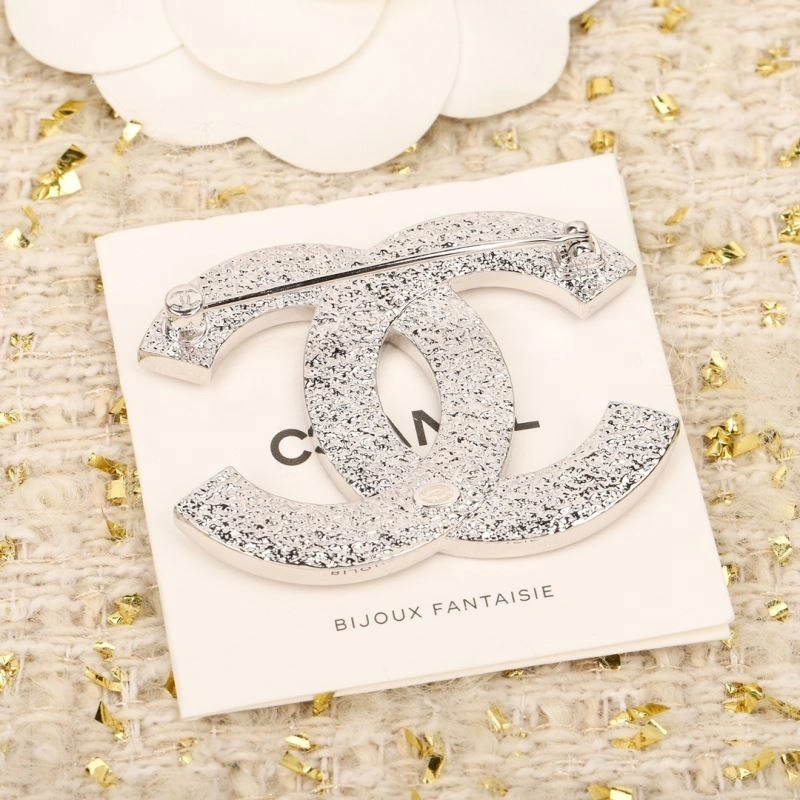 Indistinguishable Chanel Brooches