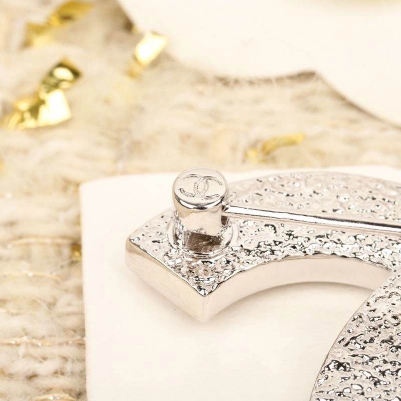 Indistinguishable Chanel Brooches