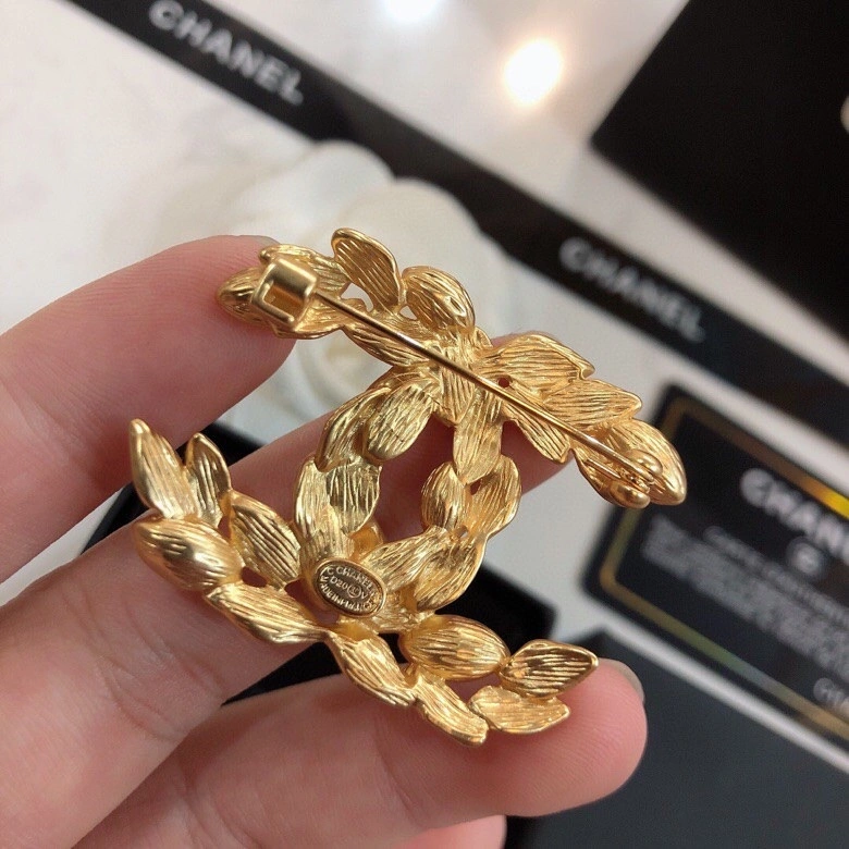 Indistinguishable Chanel Brooches
