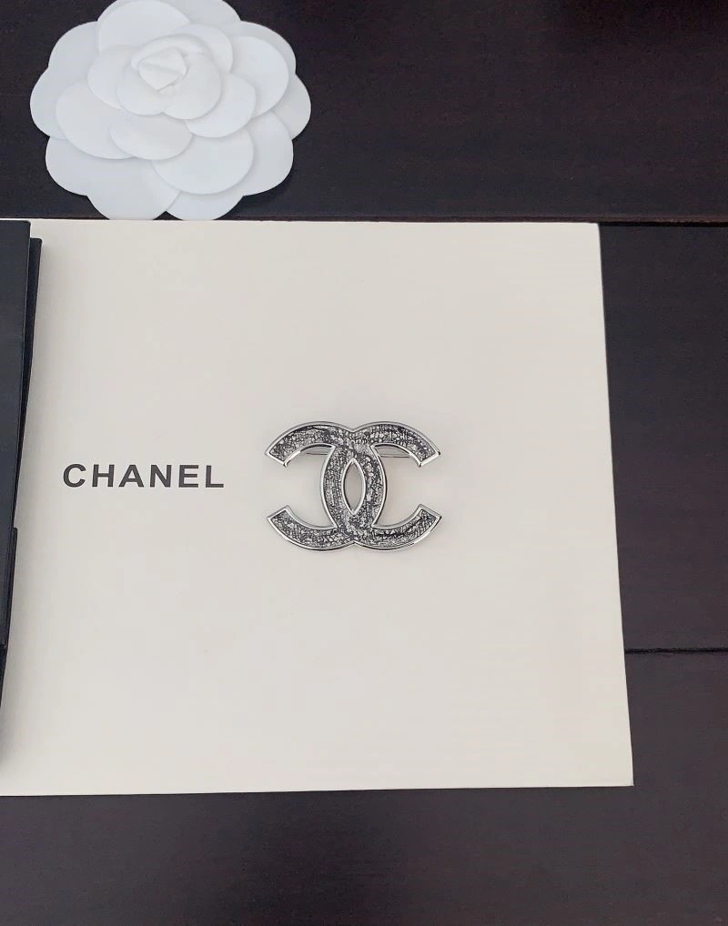 Indistinguishable Chanel Brooches