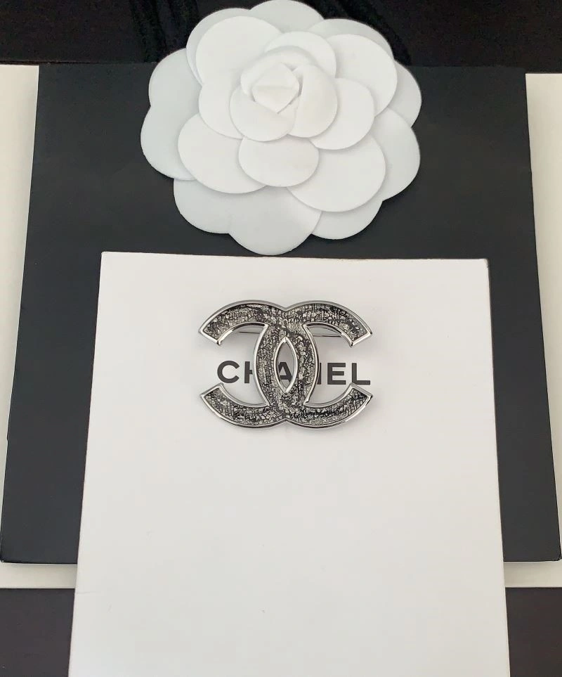 Indistinguishable Chanel Brooches